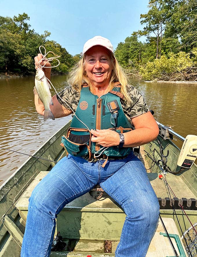 The universal truth of fishing: even a small catch feels like winning the lottery when you're surrounded by water this peaceful.