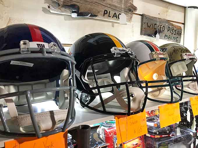 Football history lined up and ready for inspection. Each helmet tells a story of mud, glory, and probably a concussion or two from the days before safety regulations.