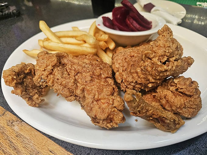Fried chicken that would make Colonel Sanders question his life choices&mdash;crispy, golden, and served with classic diner sides.