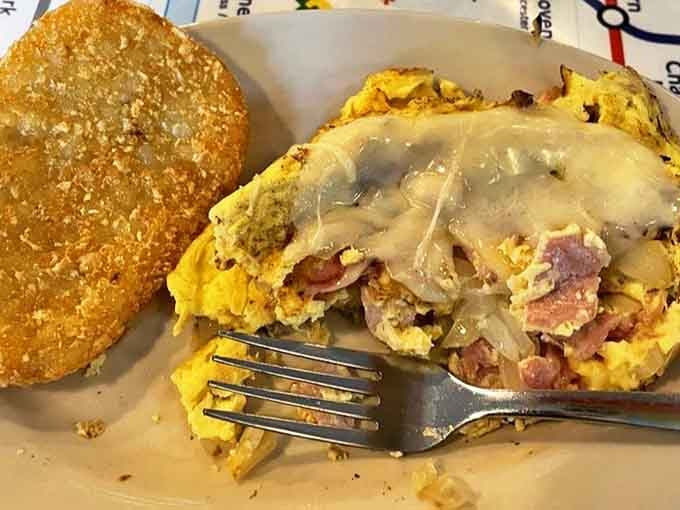 This isn't just breakfast; it's a savory morning masterpiece. The ham and cheese omelette with hash brown cake delivers comfort that transcends continents.