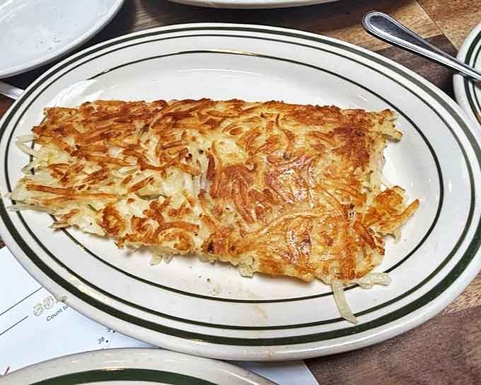 Hash browns so perfectly crispy they make that satisfying crunch when your fork breaks through &ndash; the gold standard of breakfast potato excellence.