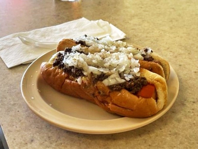 The full "all the way" treatment &ndash; meat sauce, onions, mustard, and celery salt creating a symphony of flavors in every bite.