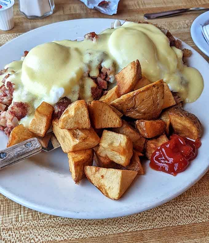 Behold the Irish Benedict&mdash;where hollandaise cascades like a golden waterfall over corned beef hash, with home fries standing by for sauce-sopping duty.