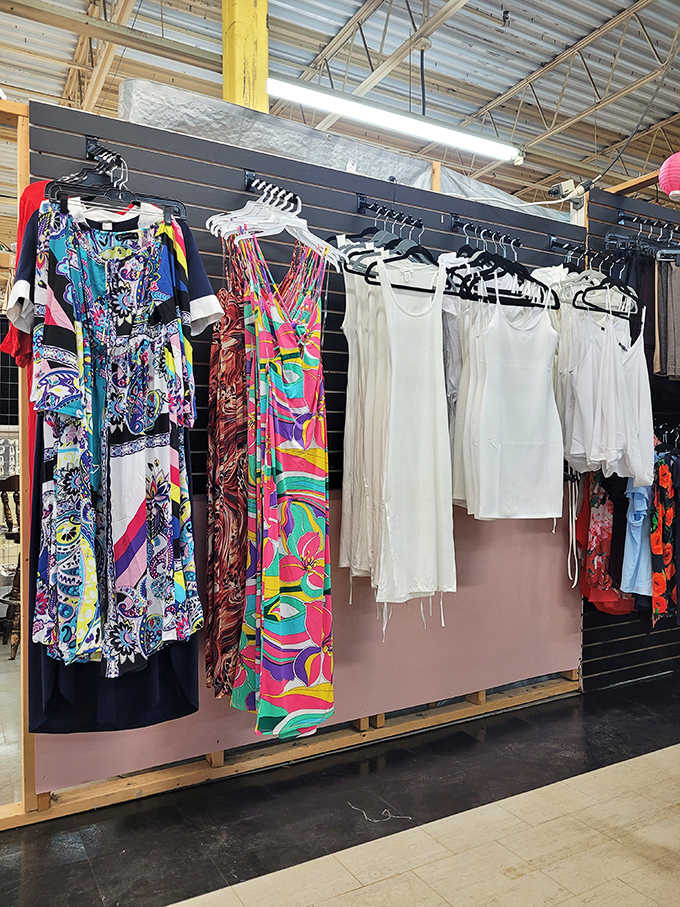 A rainbow explosion of patterns that would make Tim Gunn raise an eyebrow. Vintage dresses hanging like colorful promises of style reborn.