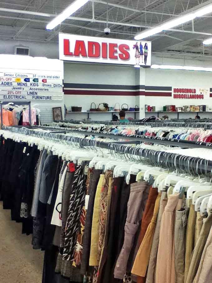 The ladies' section stretches as far as the eye can see, with decades of fashion history hanging side by side in a textile time machine.