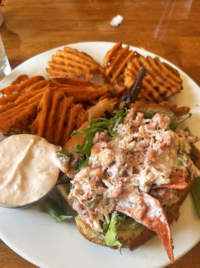 The lobster roll that launched a thousand return visits&mdash;sweet meat meets creamy dressing on a toasted bun, with sweet potato fries playing a perfect supporting role.