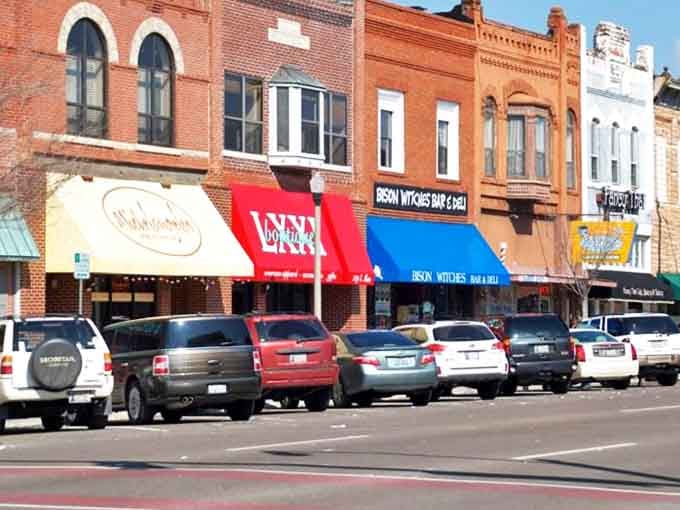 Downtown Norman's colorful awnings aren't just for show—they're beacons guiding you to local treasures. Each storefront promises a different adventure.
