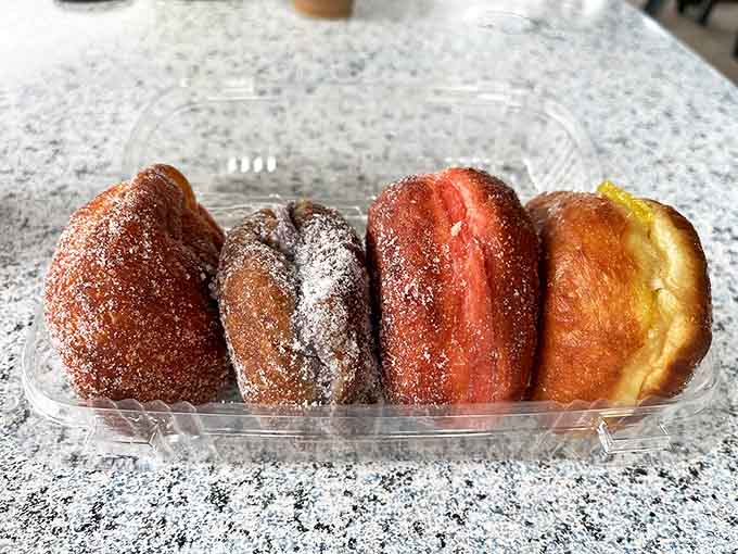 The malasada lineup looks like the United Nations of donuts&mdash;each one a different nationality of deliciousness, rolled in sugar and filled with tropical dreams.