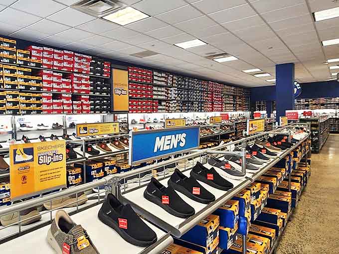 The men's shoe section: where even the most shopping-averse husbands suddenly develop strong opinions about arch support and breathable materials.