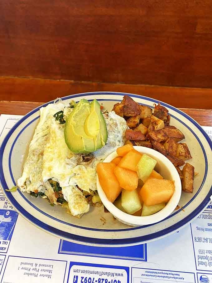 This omelet doesn't just come with avocado&mdash;it arrives with it, like they're old friends who traveled together to your plate.