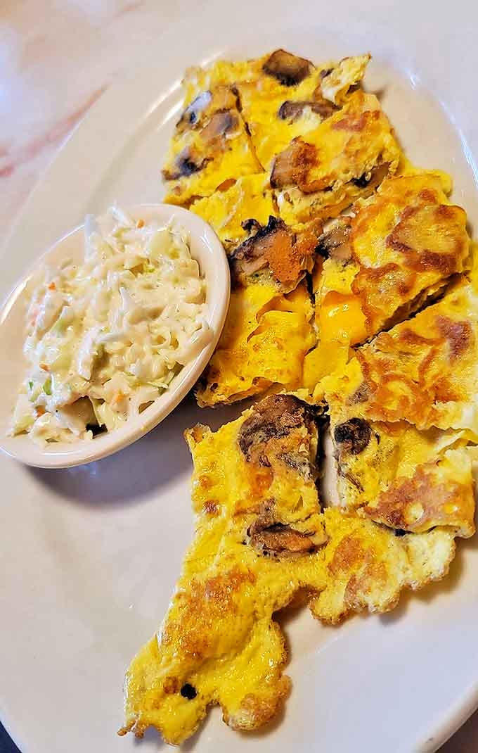 This mushroom omelet doesn't just whisper "good morning" &ndash; it belts out a Broadway-worthy "HELLO SUNSHINE!" Coleslaw as the unexpected co-star.