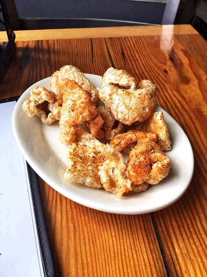 These pork rinds aren't the sad gas station variety &ndash; they're crispy clouds of porky perfection that shatter with each satisfying crunch.