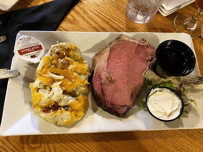 The prime rib arrives like royalty, perfectly pink and accompanied by its loyal subjects: loaded potato and horseradish cream.