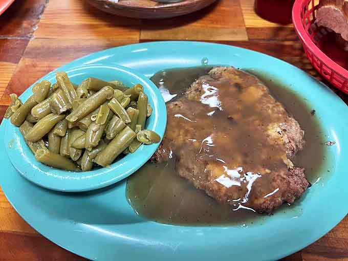 Smothered in gravy that could make cardboard taste good, though thankfully it's lavished on properly cooked meat instead.