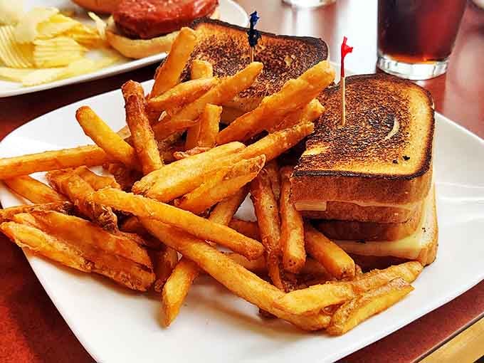Golden-brown grilled cheese and crispy fries &ndash; proof that sometimes the simplest pleasures are the most satisfying. Comfort food that never goes out of style.