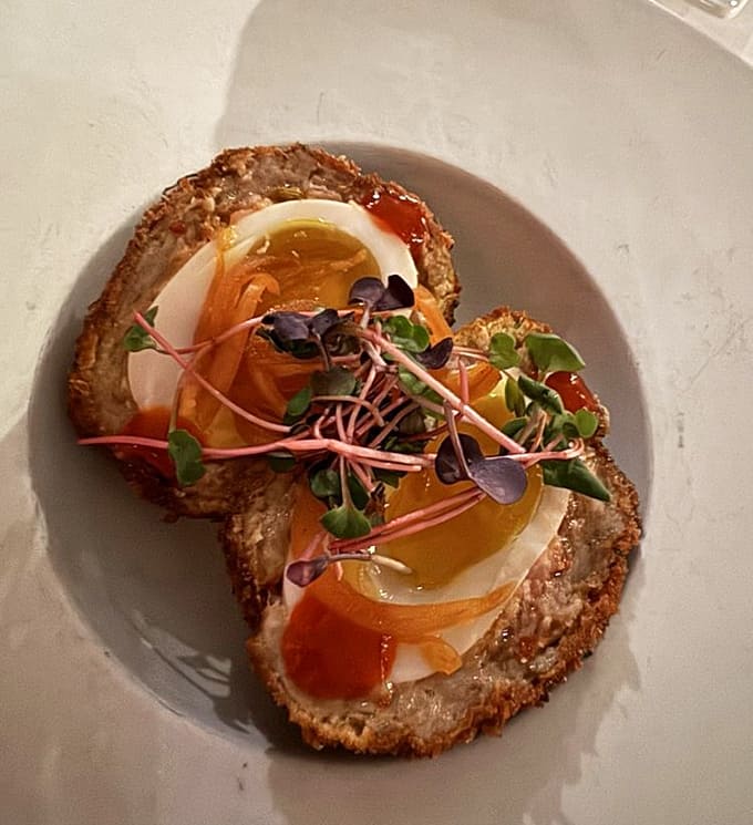 Scotch eggs reimagined with artistic flair. This isn't your grandfather's pub food&mdash;it's what he wishes he could have had after prohibition ended.