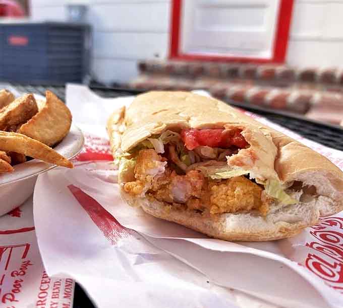 Behold the architectural marvel that is a proper shrimp po'boy&mdash;golden fried treasures from the Gulf nestled in French bread with all the proper dressings.