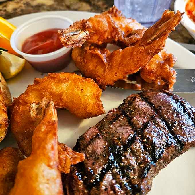 Surf meets turf in perfect harmony. Those prawns look like they're doing a victory dance around that perfectly grilled sirloin&mdash;and who could blame them?