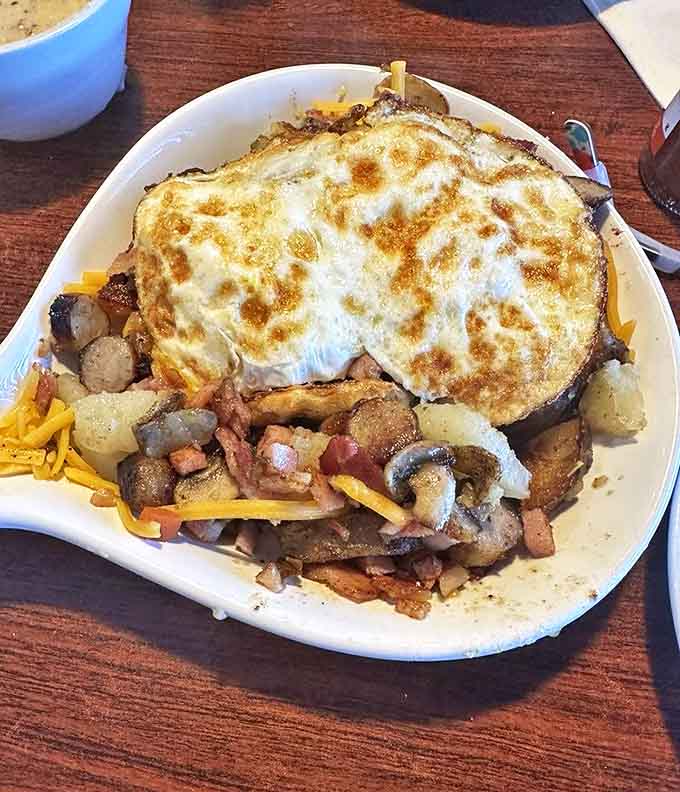 This loaded skillet is what breakfast dreams are made of &ndash; a mountain range of ingredients topped with a sunny egg summit.