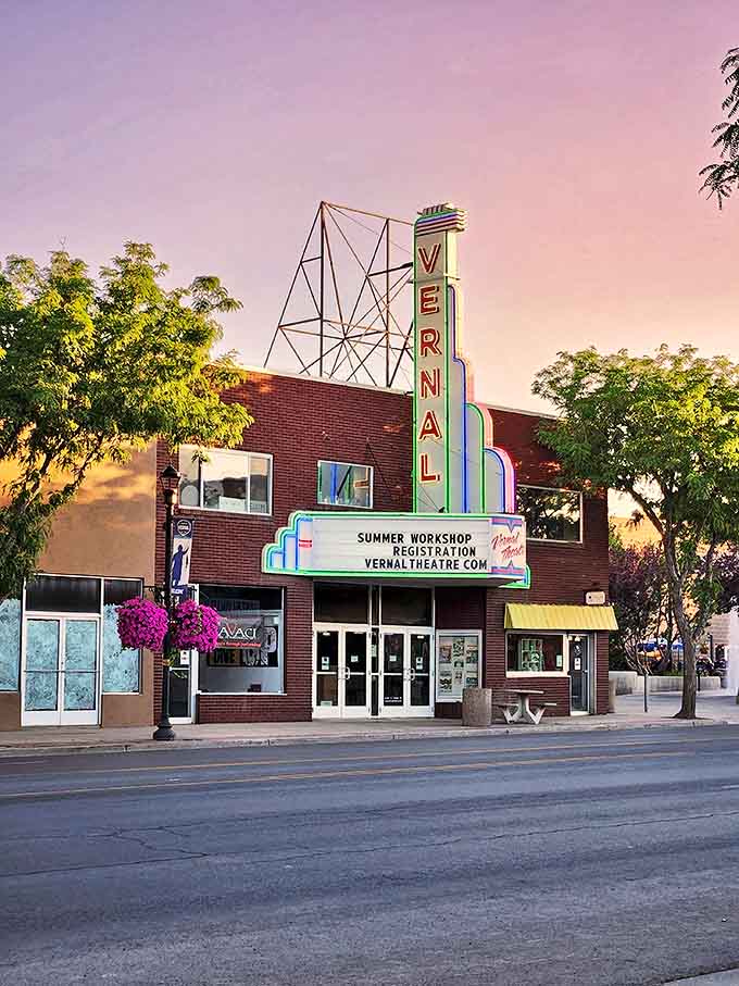 The Vernal Theatre's neon sign glows at dusk like a nostalgic beacon, promising entertainment at prices that won't require a second mortgage.