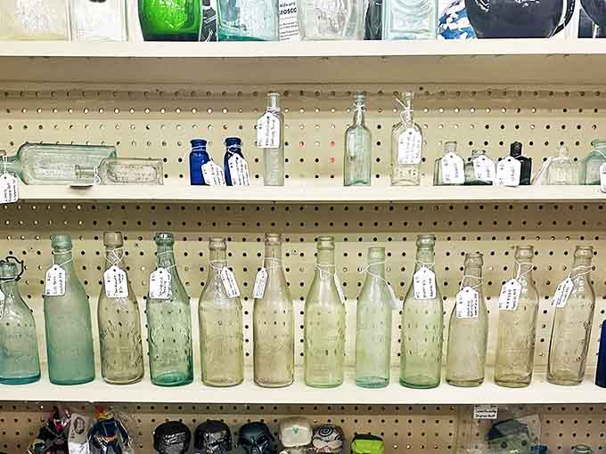 These vintage bottles aren't just glass containers – they're time capsules from an era when medicine, soda, and milk came in packaging too beautiful to discard.