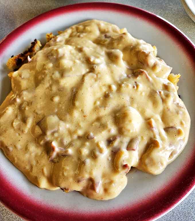 Biscuits and gravy – the breakfast equivalent of a warm hug from your grandmother. This creamy, savory blanket of goodness doesn't judge your bedhead.