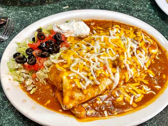 Not all heroes wear capes; some come smothered in chile verde and cheese, like this burrito that's practically begging to cure whatever ails you.