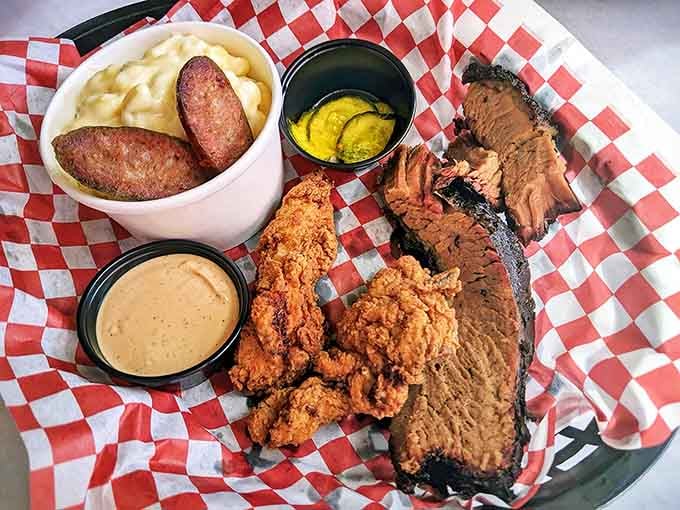 The holy trinity of barbecue: brisket with perfect bark, crispy chicken fingers, and mac and cheese that's worth every calorie.