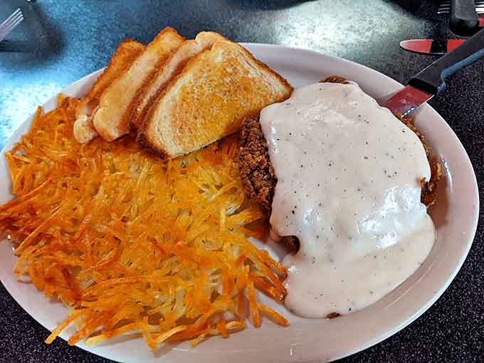Chicken fried steak with gravy so good you'll want to write home about it, alongside hash browns that achieved the perfect crisp-to-tender ratio.