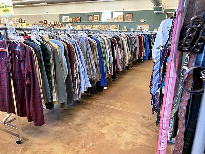 The clothing section stretches like a textile forest&mdash;each rack a timeline of fashion history where yesterday's trends await tomorrow's vintage enthusiasts.