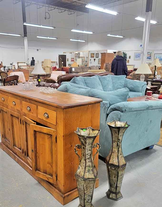 A wooden buffet meets teal sofa in an unexpected friendship. Those decorative vases look like they've seen some stories&mdash;and are ready to tell yours.