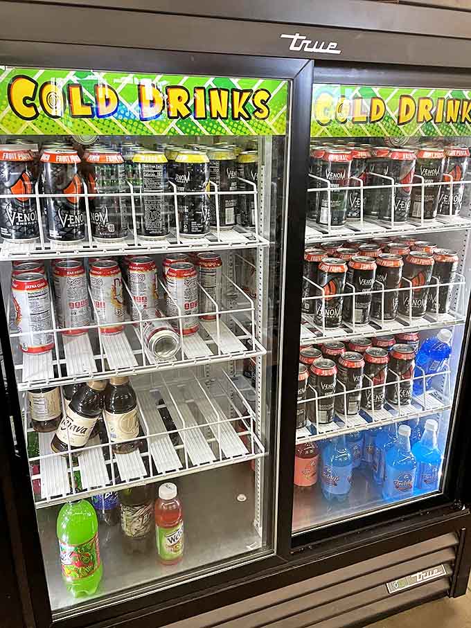The refrigerated section offers everything from energy drinks to sodas – because even your beverage choices deserve options without the premium prices.