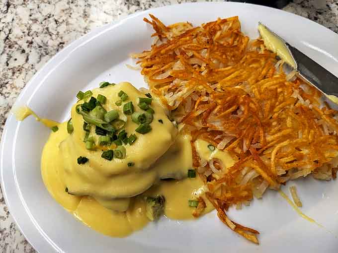 Eggs Benedict: where hollandaise sauce isn't just a topping but a philosophy. Those crispy hash browns deserve their own fan club.