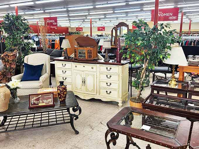 An elegant cream dresser stands sentinel among carefully arranged furniture vignettes. Someone's grandmother would approve of how they've displayed the good stuff.