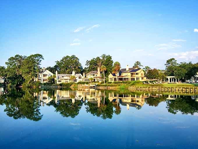 These waterfront homes reflect perfectly in still waters, creating a double dose of Lowcountry luxury that would make even the most seasoned traveler pause in appreciation.