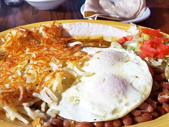 Huevos Rancheros: where hash browns, beans, and eggs unite under New Mexico's unofficial motto: "if it's not smothered in chile, is it even breakfast?"