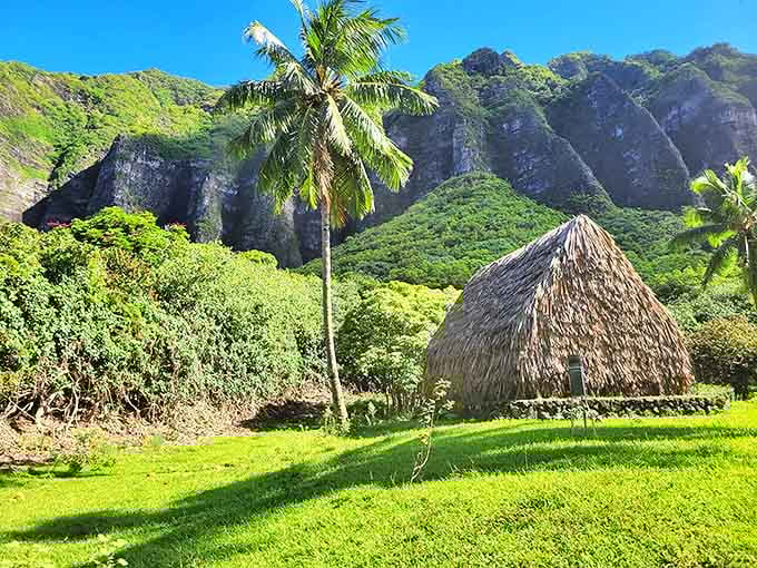 Traditional Hawaiian hale standing proudly against a backdrop that hasn't changed in centuries. Talk about authentic real estate with million-dollar mountain views!