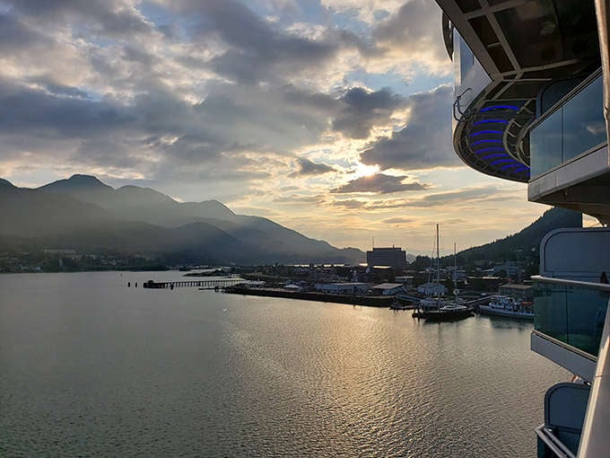 Golden hour in Skagway's harbor paints the water and mountains in hues that would make even Bob Ross reach for his palette in excited reverence.
