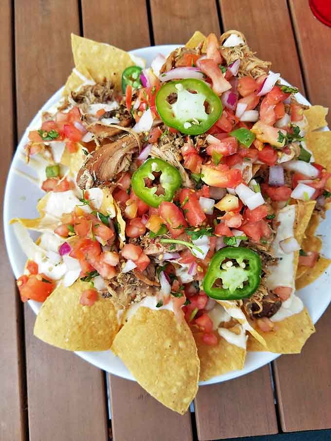 Nachos reimagined by Neptune himself&mdash;crispy chips crowned with fresh seafood, jalape&ntilde;os, and enough pico de gallo to make your taste buds dance.