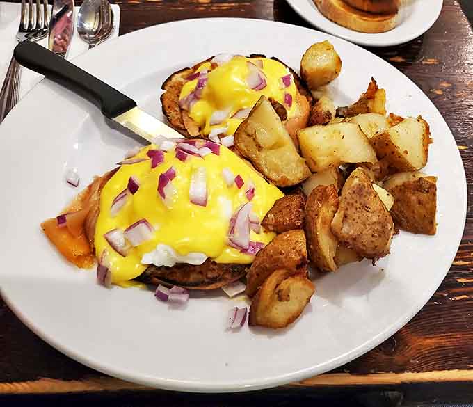 Eggs Benedict with a golden hollandaise cascade – proof that some morning classics never need reinvention, just perfect execution.