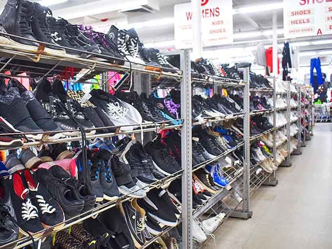 The footwear section: where athletic shoes, dress heels, and work boots coexist in harmonious possibility. Your next favorite pair waits patiently among this organized chaos.
