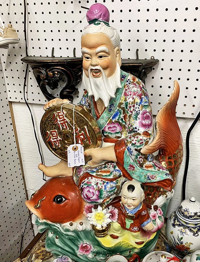 This elaborate Chinese figurine has seen more history than your history teacher, and he's not shy about showing off his colorful robe.