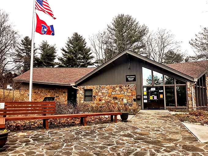 This rustic visitor center doesn't just welcome you—it practically hugs you. Stone and timber architecture that says "come in, the trail maps are free."