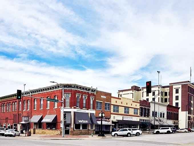 Explore the historic heart of Independence, Kansas, where charming red-brick architecture and local storefronts create a warm, inviting community atmosphere.
