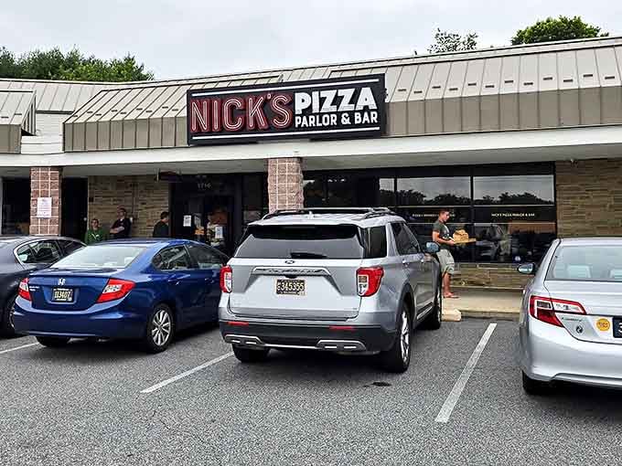 Nick's Pizza Parlor & Bar keeps it straightforward with a sign that gets right to the point. No frills needed when the pizza speaks for itself.