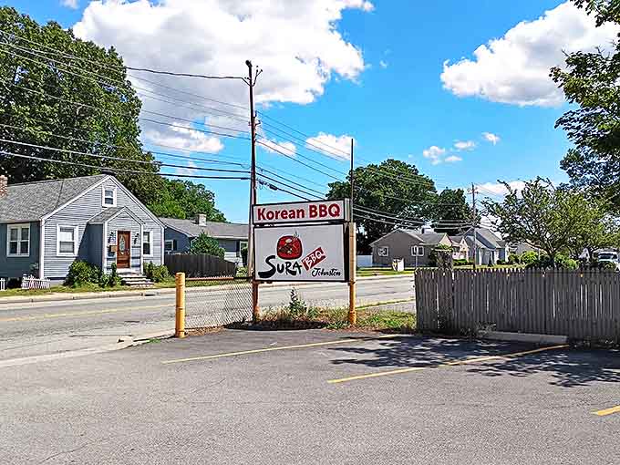 Sura's roadside sign promises Korean BBQ adventures in a neighborhood setting. No passport required, just an appetite.