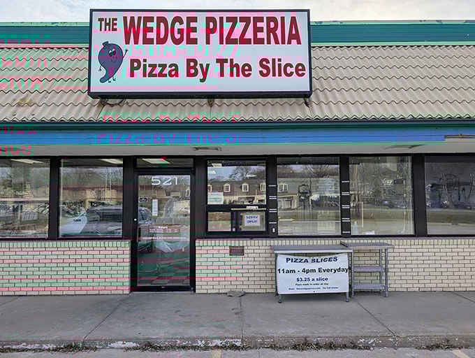 The Wedge's straightforward storefront makes a simple promise: pizza by the slice that will make your day infinitely better.
