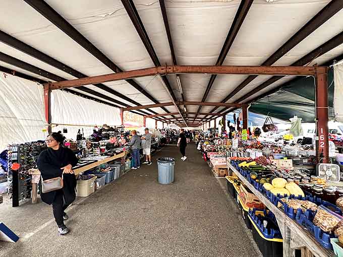 Rustic charm meets bargain hunting under wooden pavilions where RV campers and locals share tips about hidden gems.