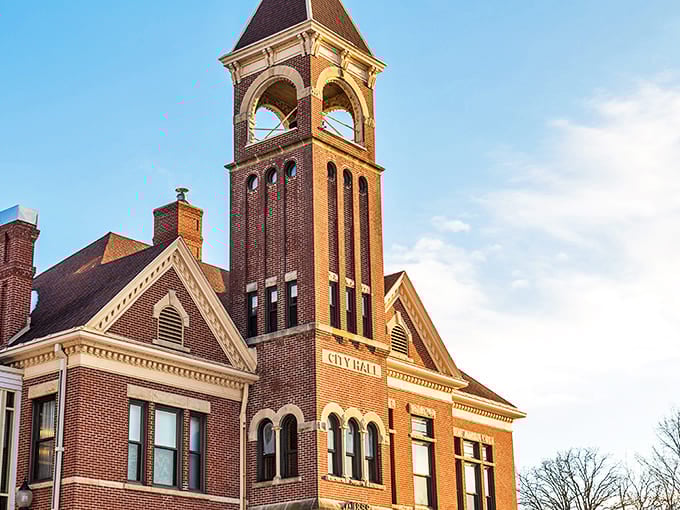 Historic brick beauty standing tall against the Minnesota sky. This city hall tower has witnessed more small-town drama than a season of Yellowstone.