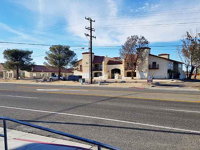 A simple storefront with Spanish-style architecture in Ridgecrest. Desert charm without the tourist-town prices.